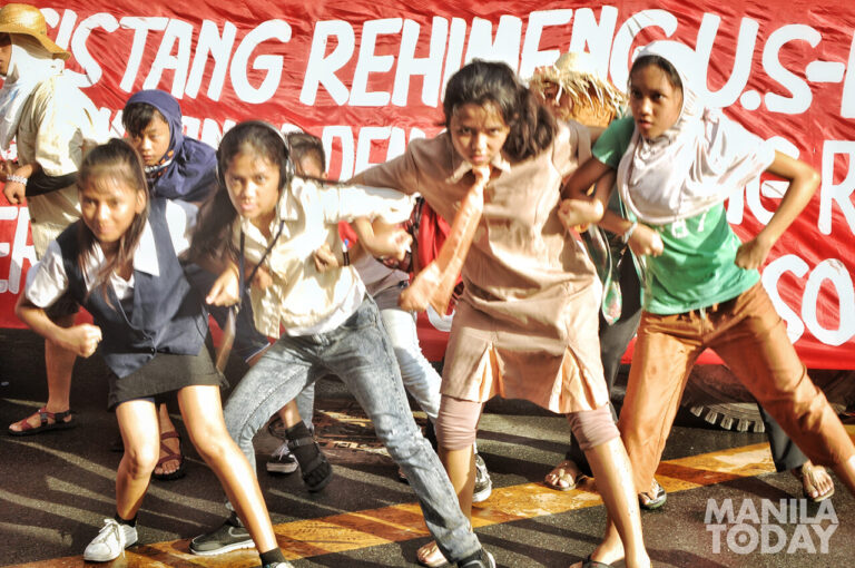 IN PHOTOS: Progressives march against fascism on Bonifacio Day ...